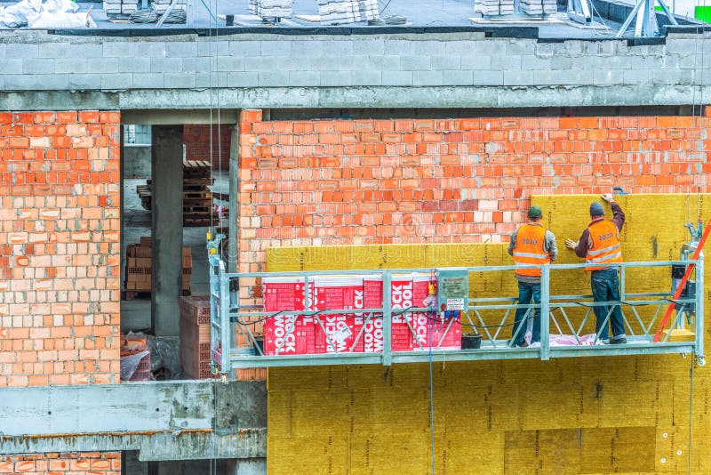 Workers Work on a Construction Site. Editorial Stock Photo - Image of ...