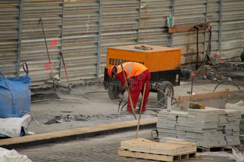 Workers Work at a Construction Site that is Under Construction, with ...