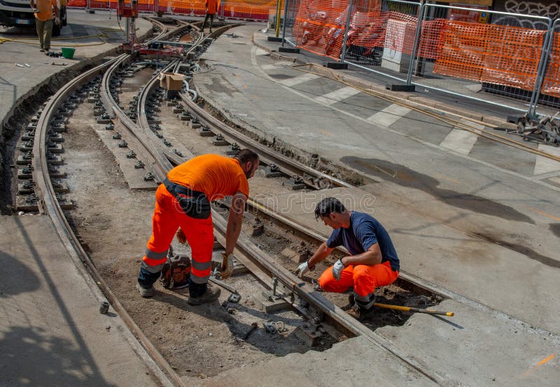 Workers at Work while Sistenabo the Tram Rails Editorial Image - Image ...