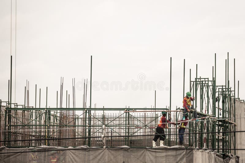 Workers are Working on Building Editorial Stock Photo - Image of ...