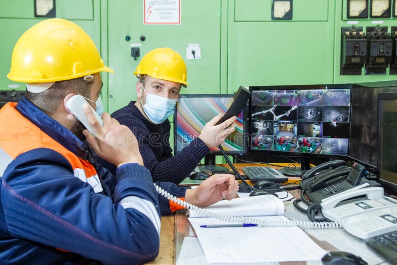 Workers with Yellow Helmet and Protective Mask at Work Stock Photo ...