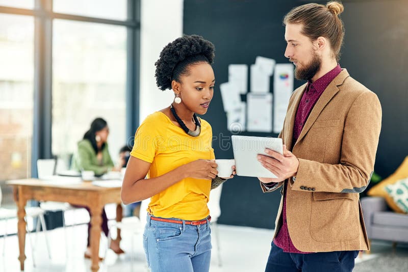 Working Alongside Technology is Essential in a Creative Business. Young ...