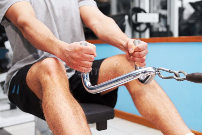 Working those Arms. Cropped Image of a Man Using Equipment at the Gym ...