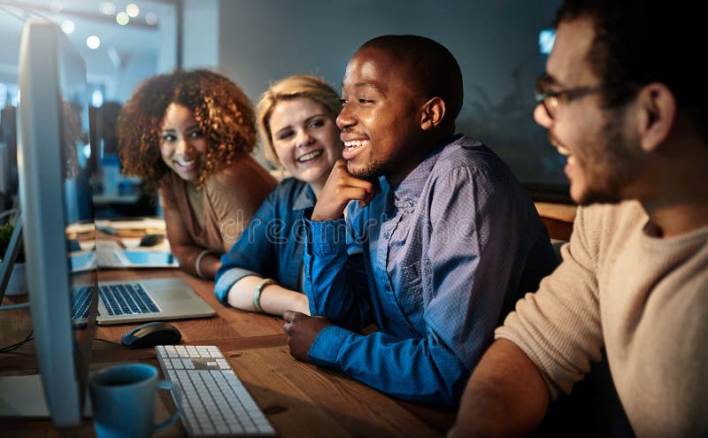 Working Around the Clock. Shot of a Team of Young Businesspeople ...