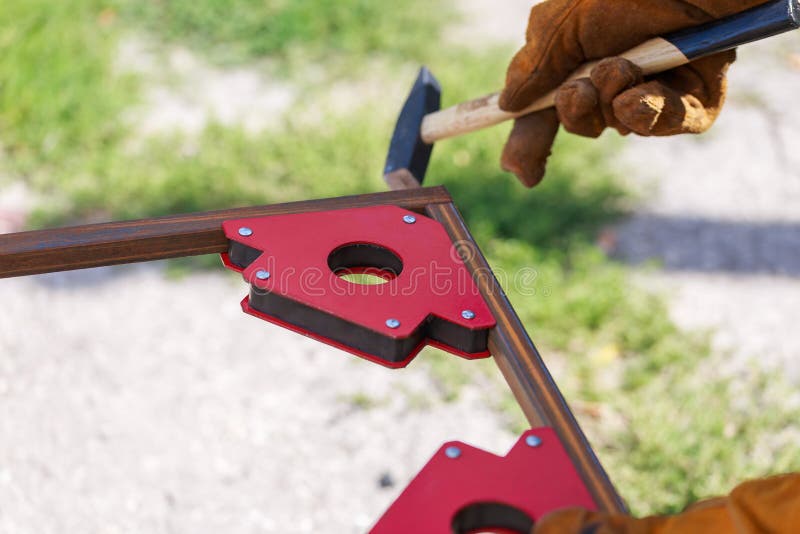 Working Auxiliary Tools in the Hands of a Worker Welder. Using a ...
