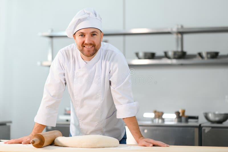 While Working in Bakery Using Rolling Pin, Male Cook Makes Thin Flat ...