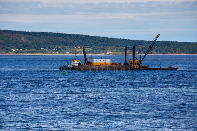 Working Barge on Canadian Coast Stock Image - Image of equipment, barge ...