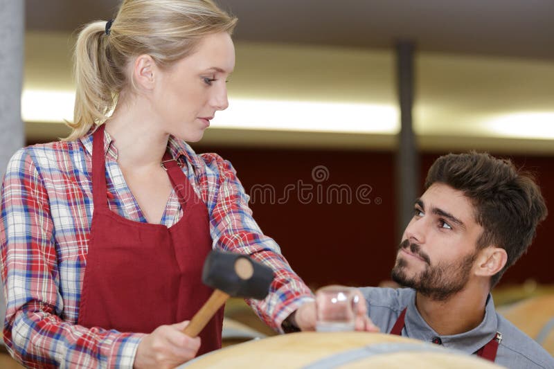 Working with Barrels in Wine Factory Warehouse Stock Image - Image of ...