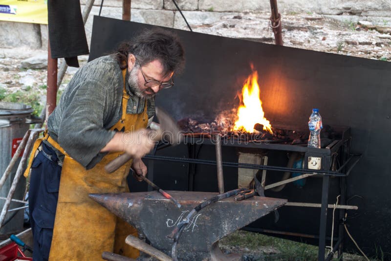 Working blacksmith editorial stock image. Image of metalwork - 45949819