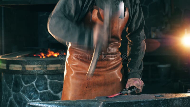 Working Blacksmith Shaping Hot Knife on Anvil Stock Video - Video of ...