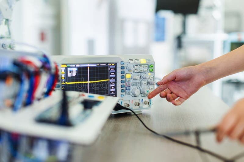 Working on Circuit Board, Building Robot in after-school Robotics Club ...
