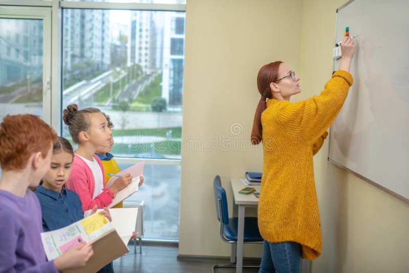 Teacher Working with Children Using the Whiteboard Stock Photo - Image ...