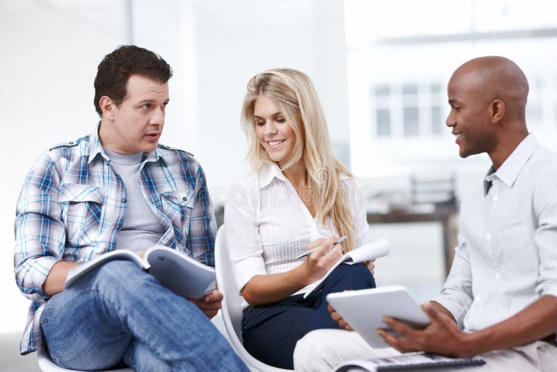 Working on a Client Presentation. a Group of Businesspeople in a ...