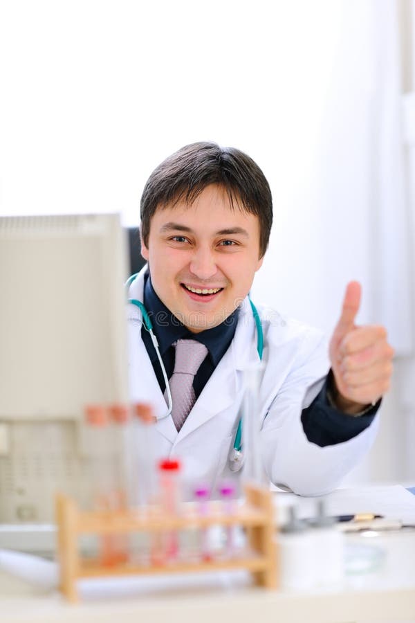 Working on Computer Doctor Showing Thumbs Up Stock Image - Image of ...