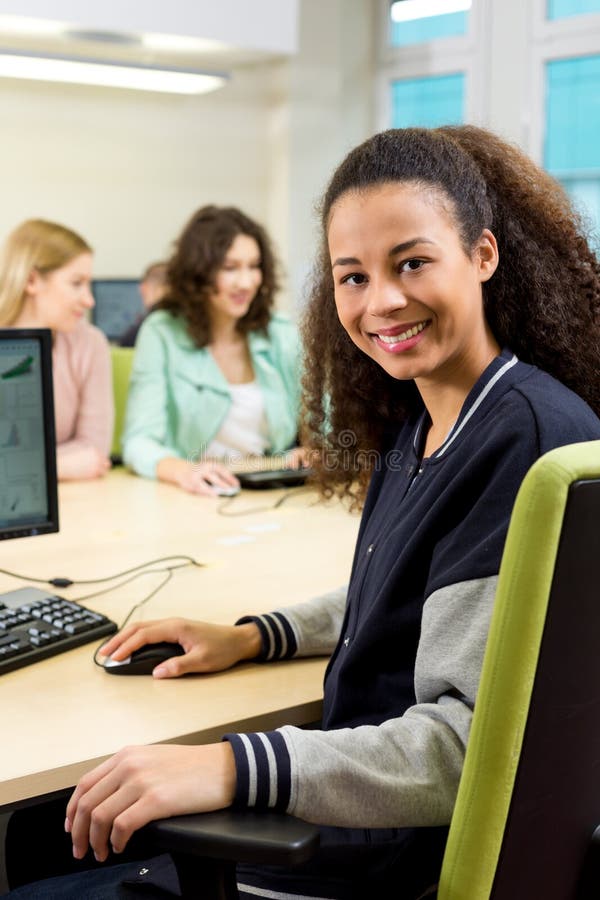 Working with the Computer Provides a Smile Stock Image - Image of ...