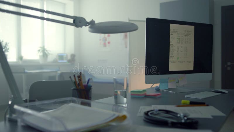Working Computer Standing Doctor Desktop in Empty Medical Cabinet Close ...