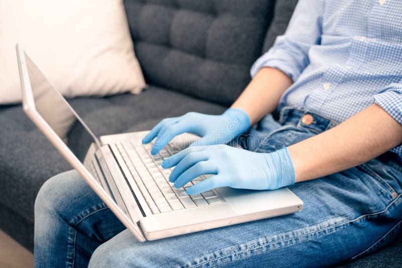 Using Computer Protected with Gloves during Coronavirus Pandemic Stock ...