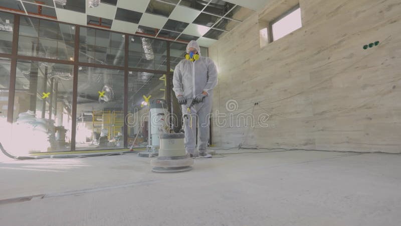 Working on a Concrete Floor at a Construction Site. Working Process at ...