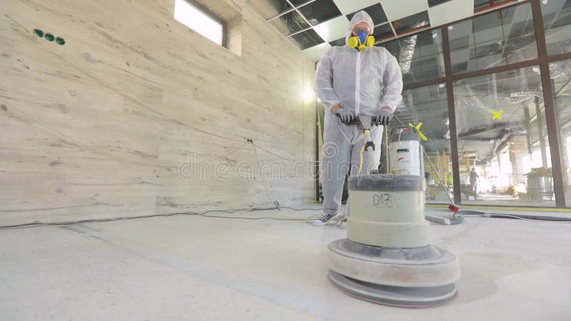 Working on a Concrete Floor at a Construction Site. Working Process at ...