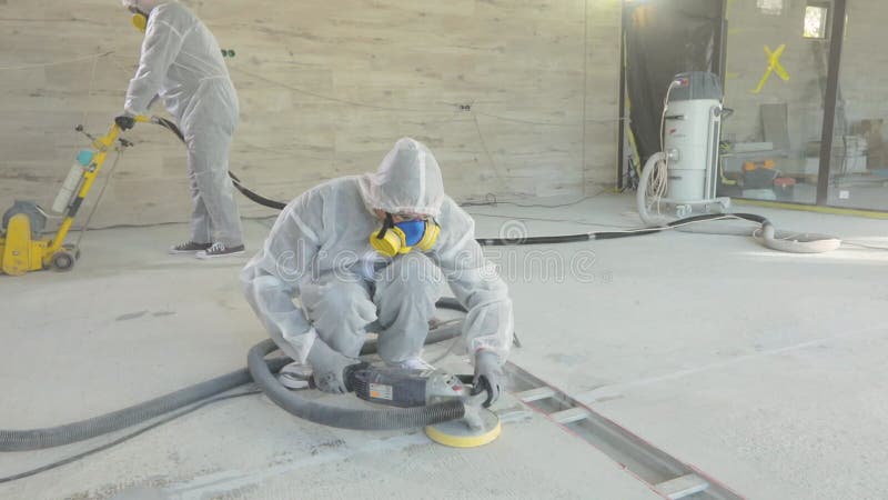 Working on a Concrete Floor at a Construction Site. Working Process at ...