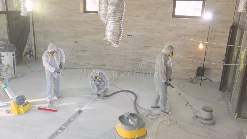 Working on a Concrete Floor at a Construction Site. Working Process at ...