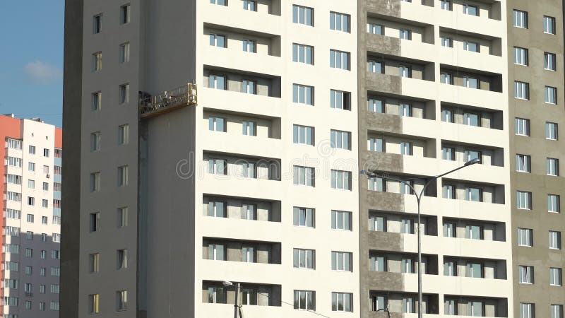 Working in a Construction Cradle Rubs Plaster Stock Footage - Video of ...