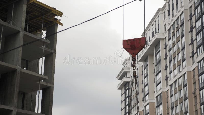 Working Construction Crane at Building Site. High Tower Crane Lifts ...