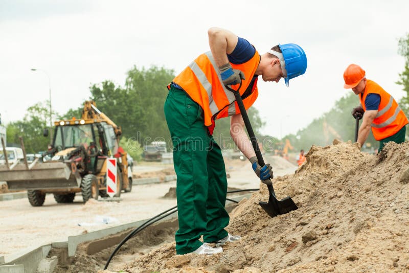 Working at Construction Site Stock Image - Image of caucasian, spade ...