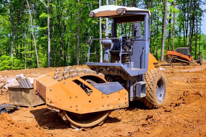 Working on a Construction Site with an Excavator Tractor Equipment ...