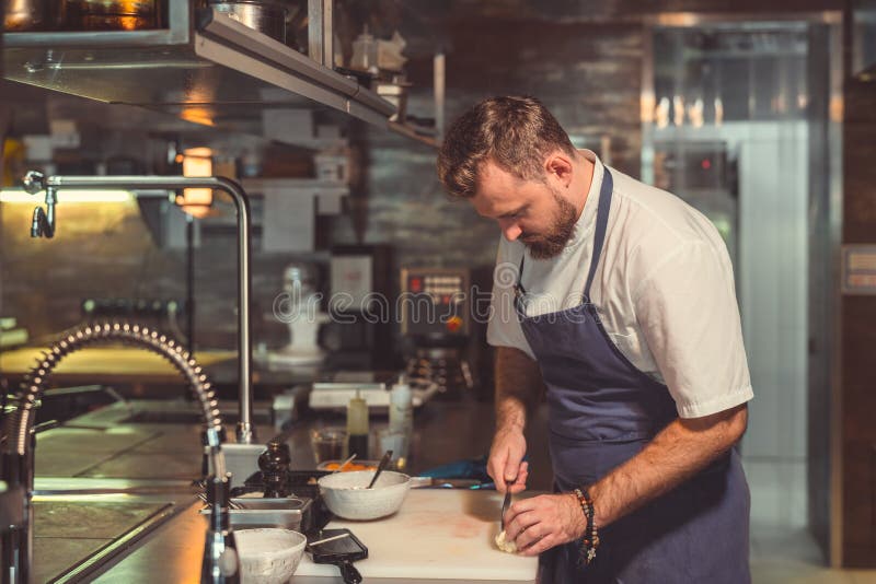 Working cook indoors stock image. Image of ingredient - 108691487