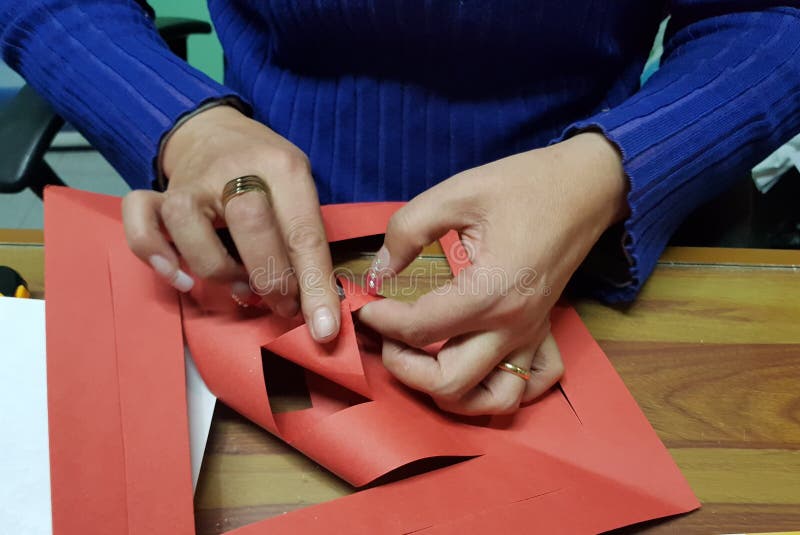 Working on Crafts with Cardboard Red Hands Stock Image - Image of hands ...