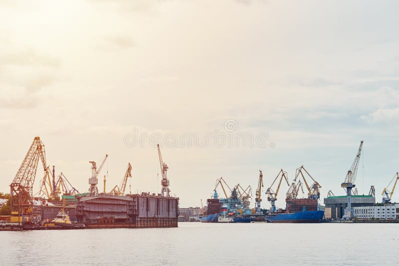Working Crane Bridge in Shipyard and Cargo Ships in a Port Stock Photo ...