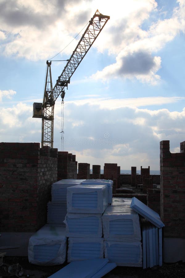 Working Crane on the Construction of the House. Construction of a ...