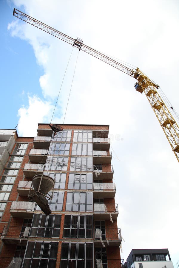 Working Crane on the Construction of the House. Construction of a ...