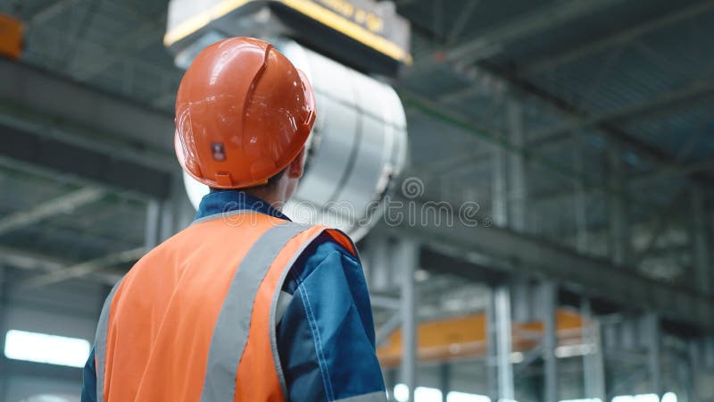 A Working Crane Operator is Engaged in Loading Rolled Metal Products at ...