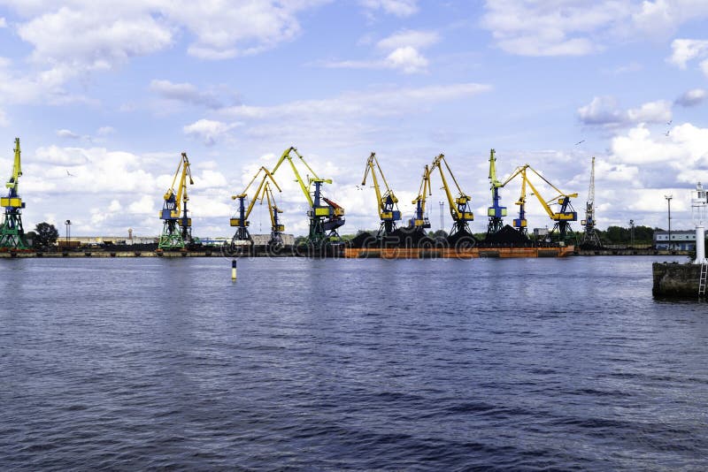 Working Crane in the Port, the Cargo in the Port Pier at the Loading of ...