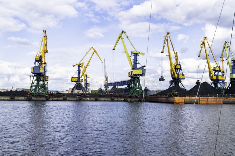 Working Crane in the Port, the Cargo in the Port Pier at the Loading of ...