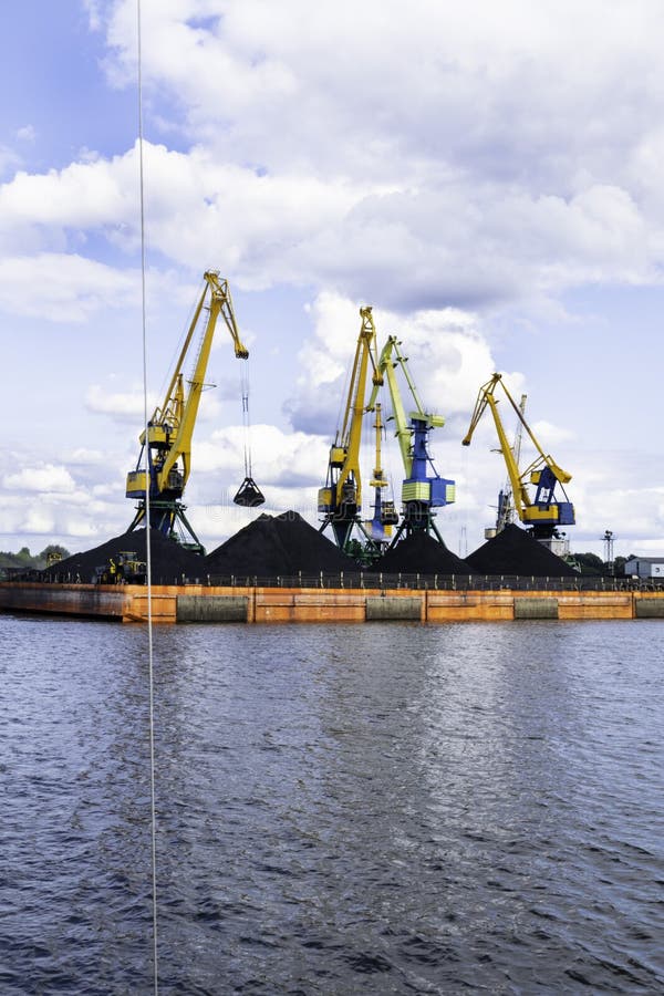 Working Crane in the Port, the Cargo in the Port Pier at the Loading of ...