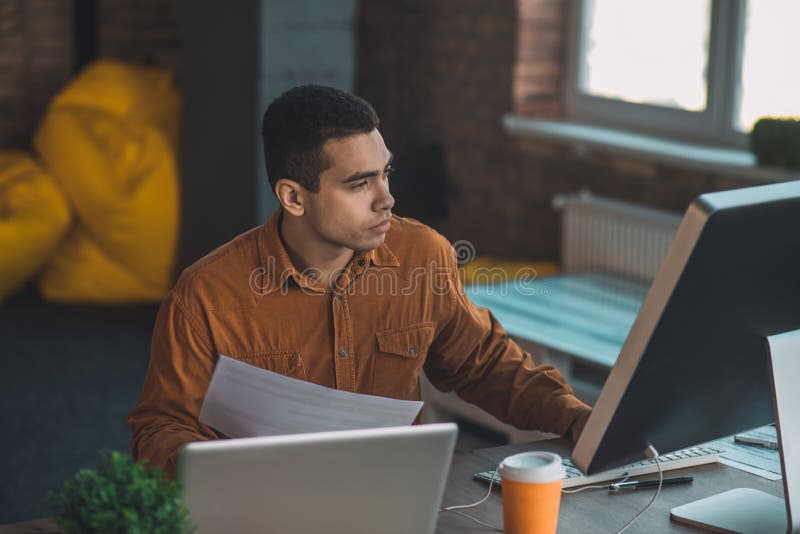 Smart Concentrated Young Man Working in the Office Stock Image - Image ...