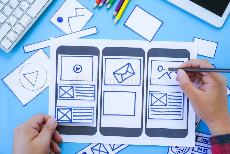 Working Desk with Hands Sketching of Screens for Mobile Responsive ...