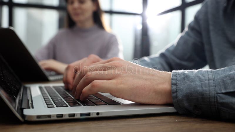 Working at a Desk with a Laptop in the Office with a Business Team ...