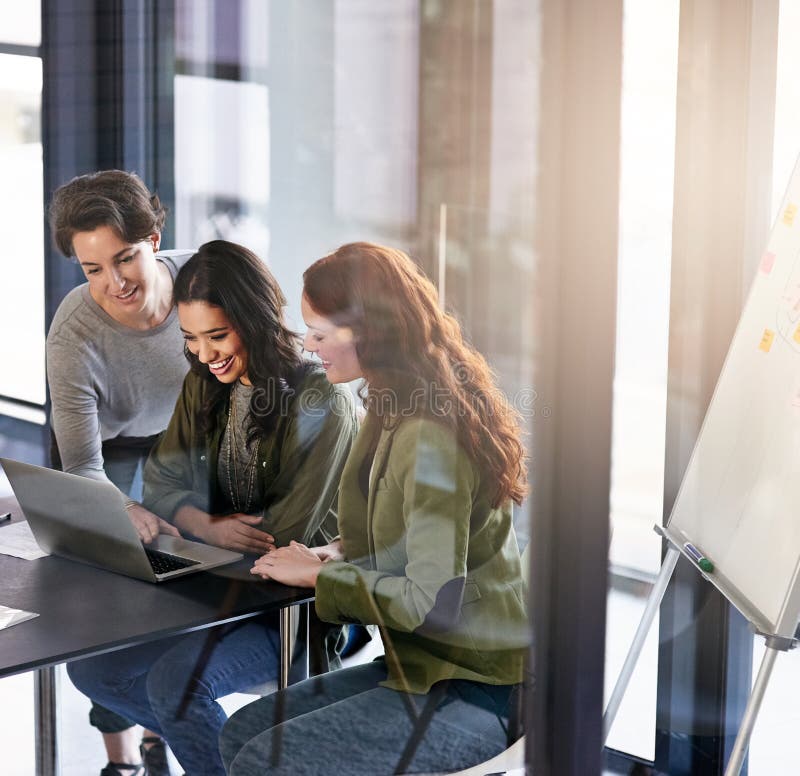 Working through the Details Together. a Group of Colleagues Working ...
