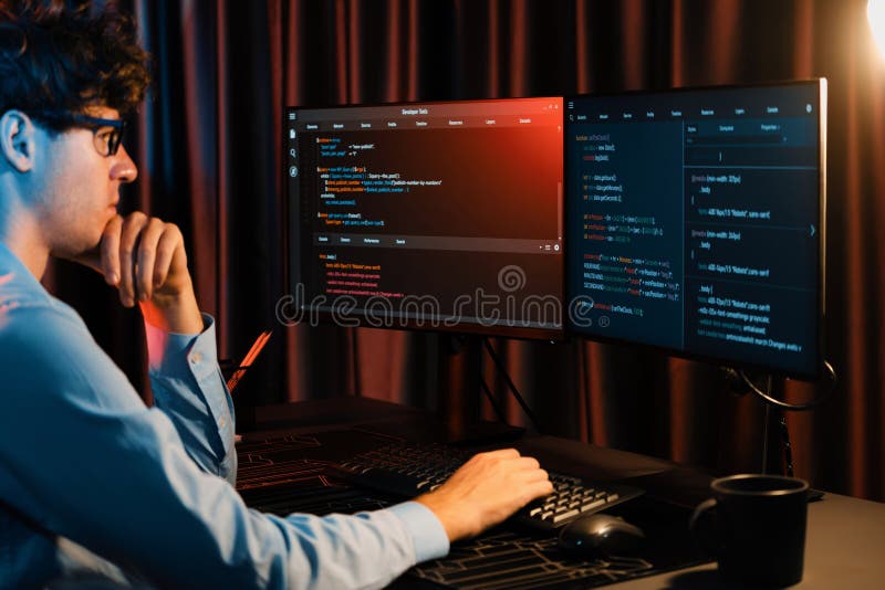 Working it Developer Concentrating Online Software at Neon Light Room. Gusher. Stock Image ...