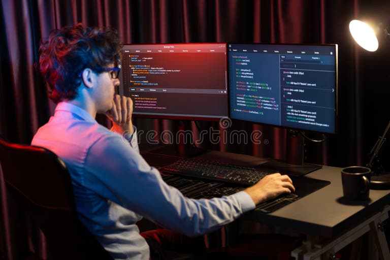 Working it Developer Concentrating Online Software at Neon Light Room. Gusher. Stock Photo ...