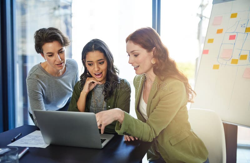 Working Efficiently with Technology. a Group of Businesswomen Working ...