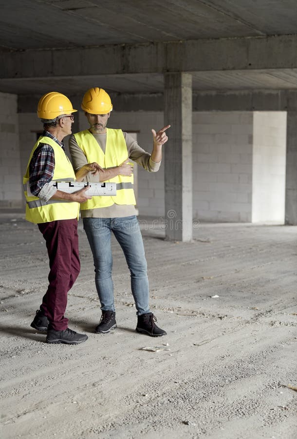 Working Engineers on the Construction Site Stock Image - Image of full ...