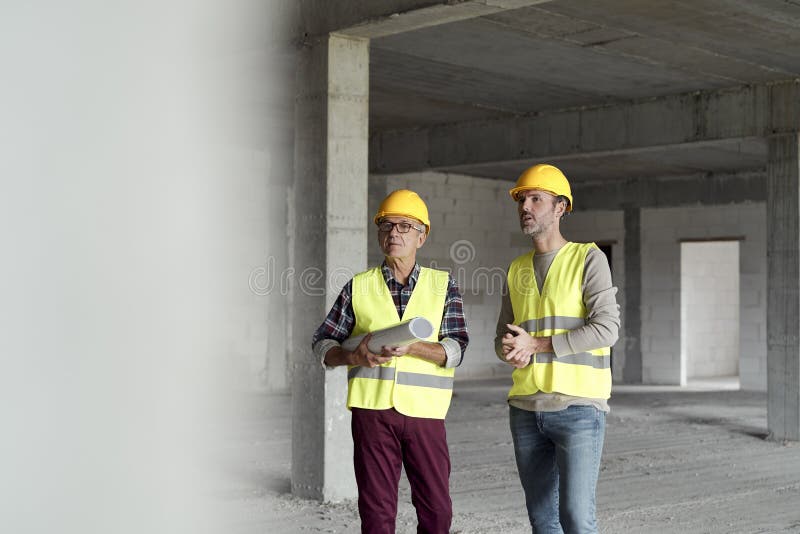 Working Engineers on the Construction Site Stock Image - Image of ...