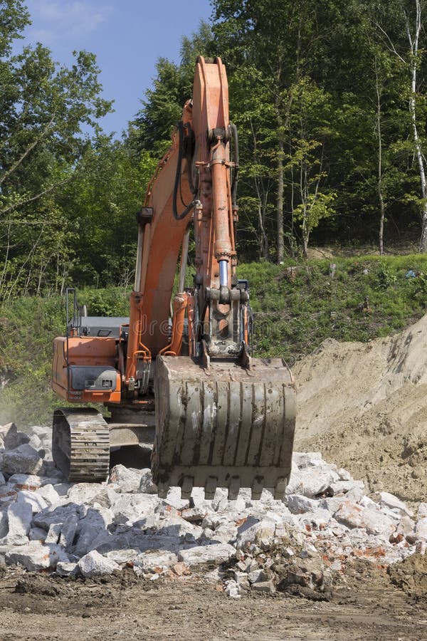 Working Excavator during the Removal of Stones Stock Photo - Image of ...