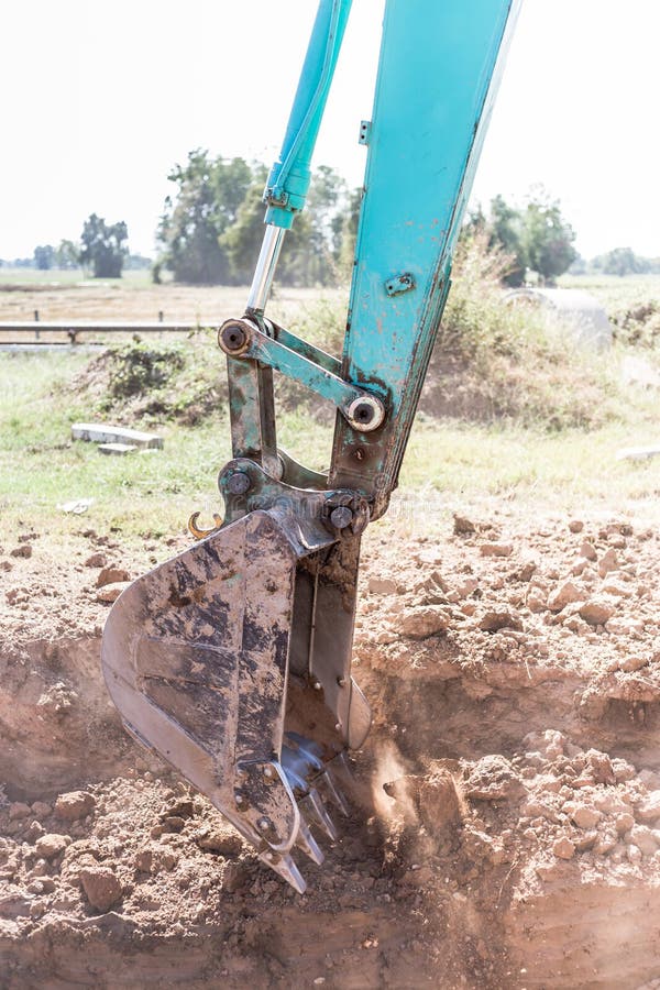 Working Excavator Tractor Digging a Trench. Stock Photo - Image of ...