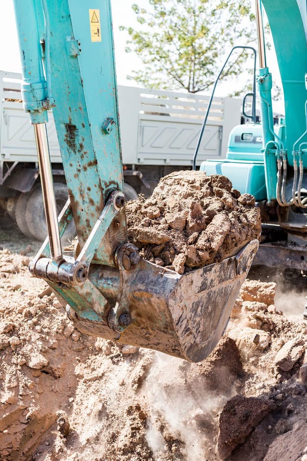 Working Excavator Tractor Digging a Trench. Stock Photo - Image of ...